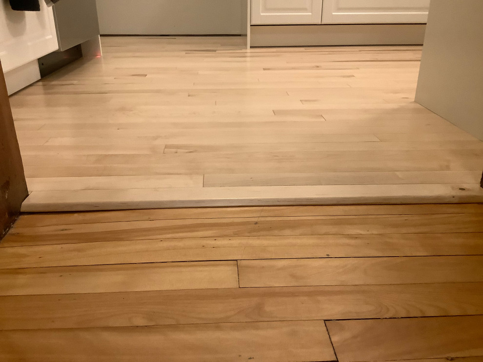 Hardwood floor gap under transition piece