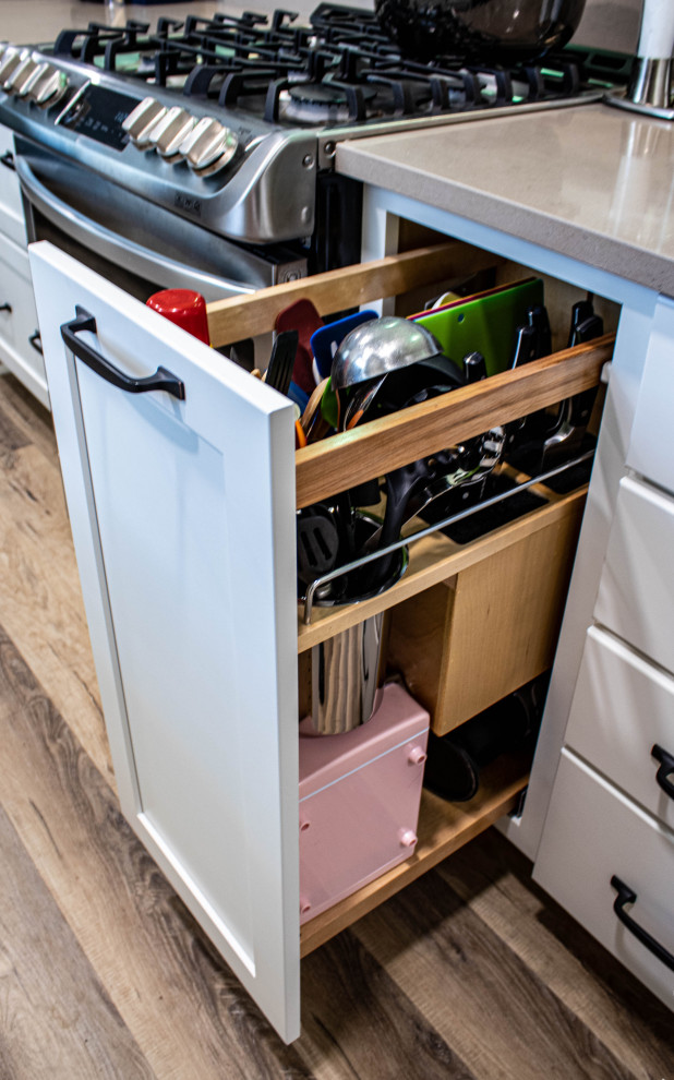 White Kitchen with Blue Tiled Backsplash and Two Tier Island ...