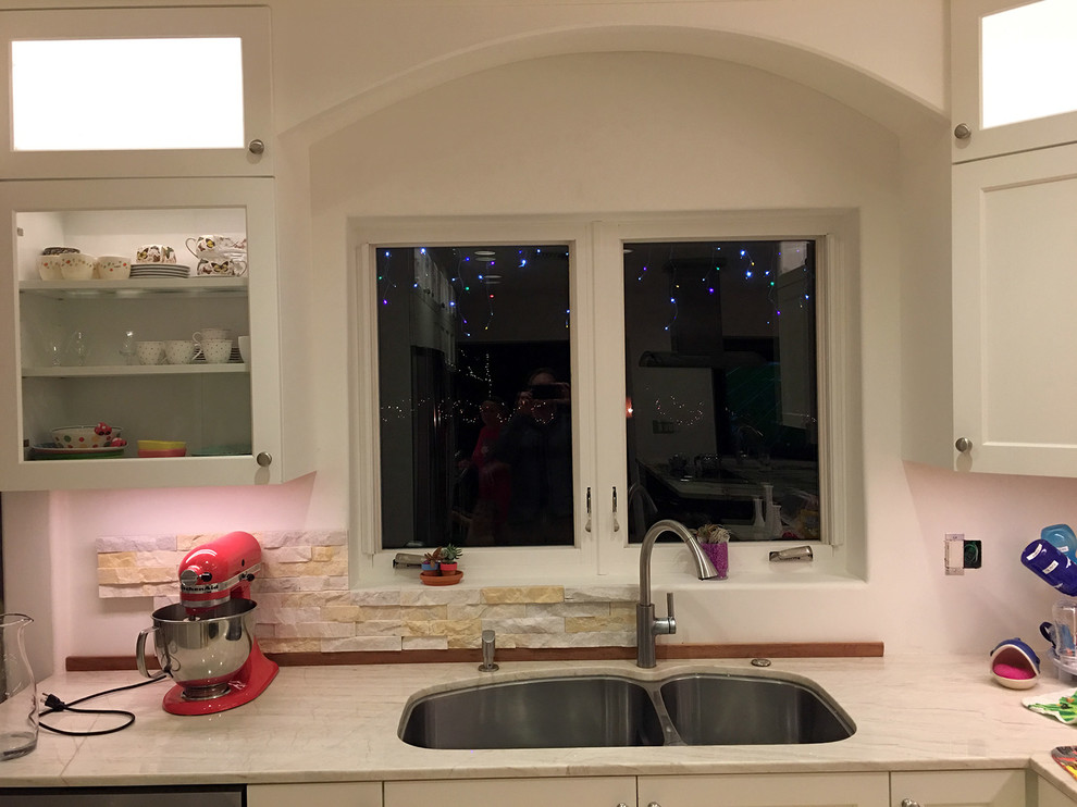 How should stone backsplash flow around the window area?