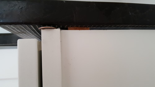 Granite counter installed with shims - problem?