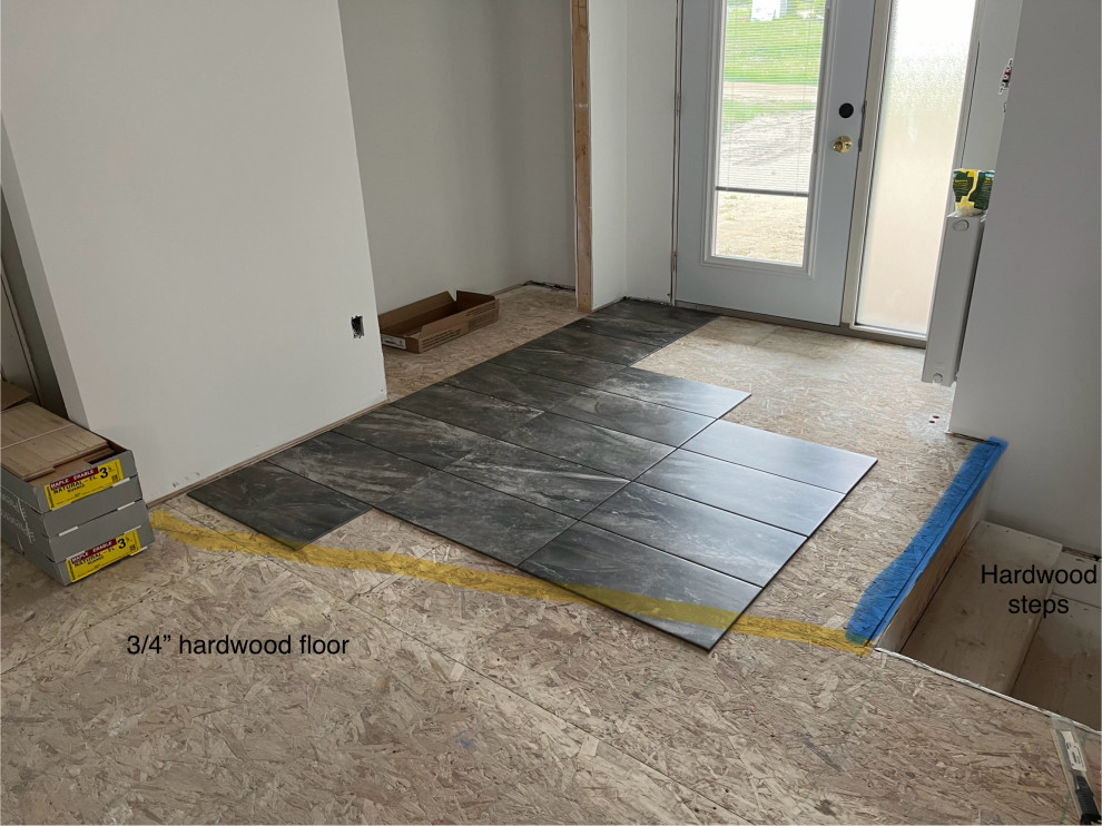 How to transition from porcelain tile at front door to hardwood stairs ...