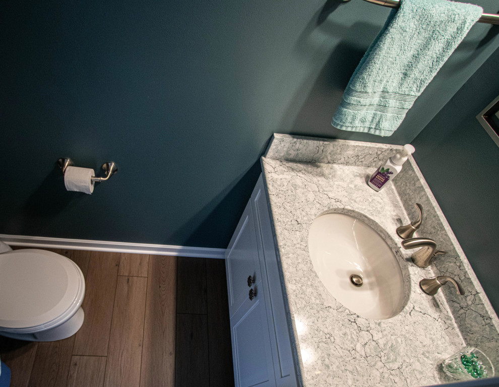 Green Powder Room with White Vanity and Beige and Green Countertop ...