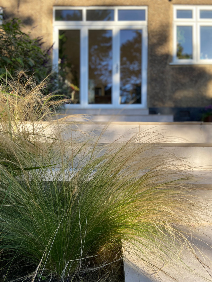 Porcelain steps and Corten planters in a London rear garden ...