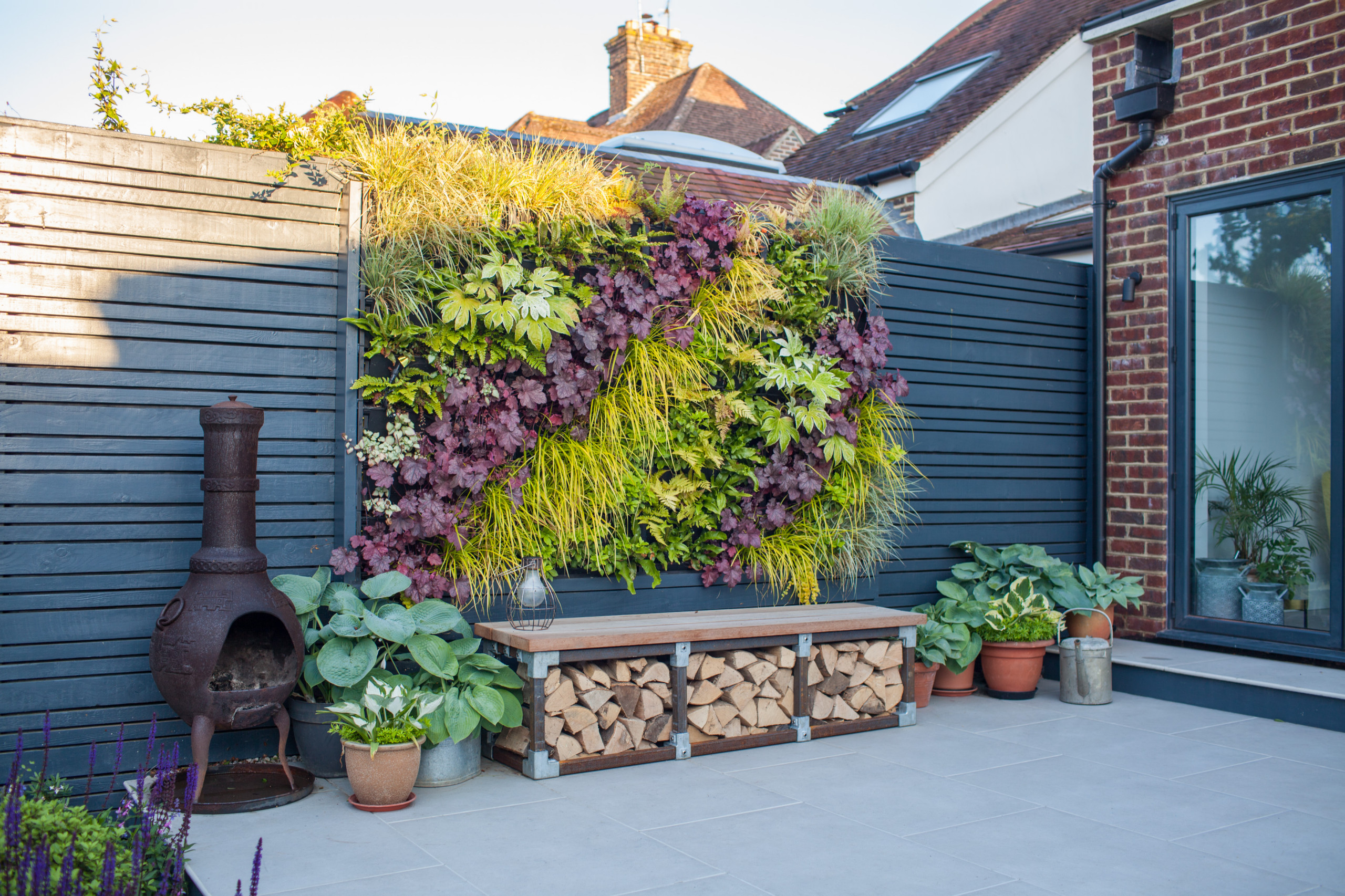 Garden Tour: A Family’s Sociable Outdoor Space With a Living Wall ...