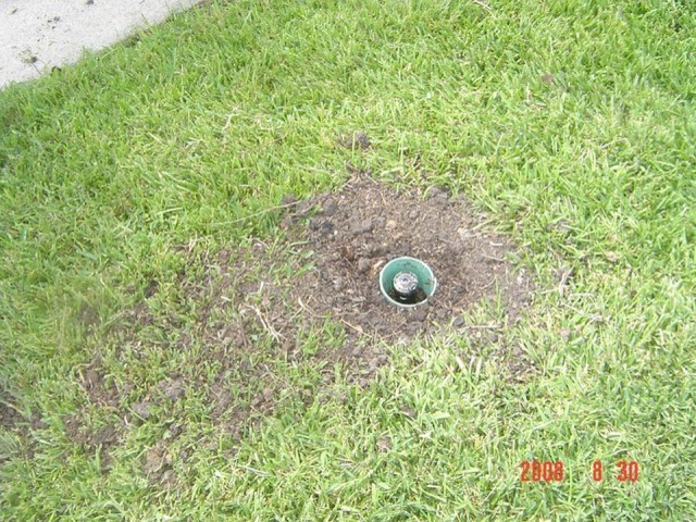 methods to protect pop-up sprinkler heads from rising soil vs add