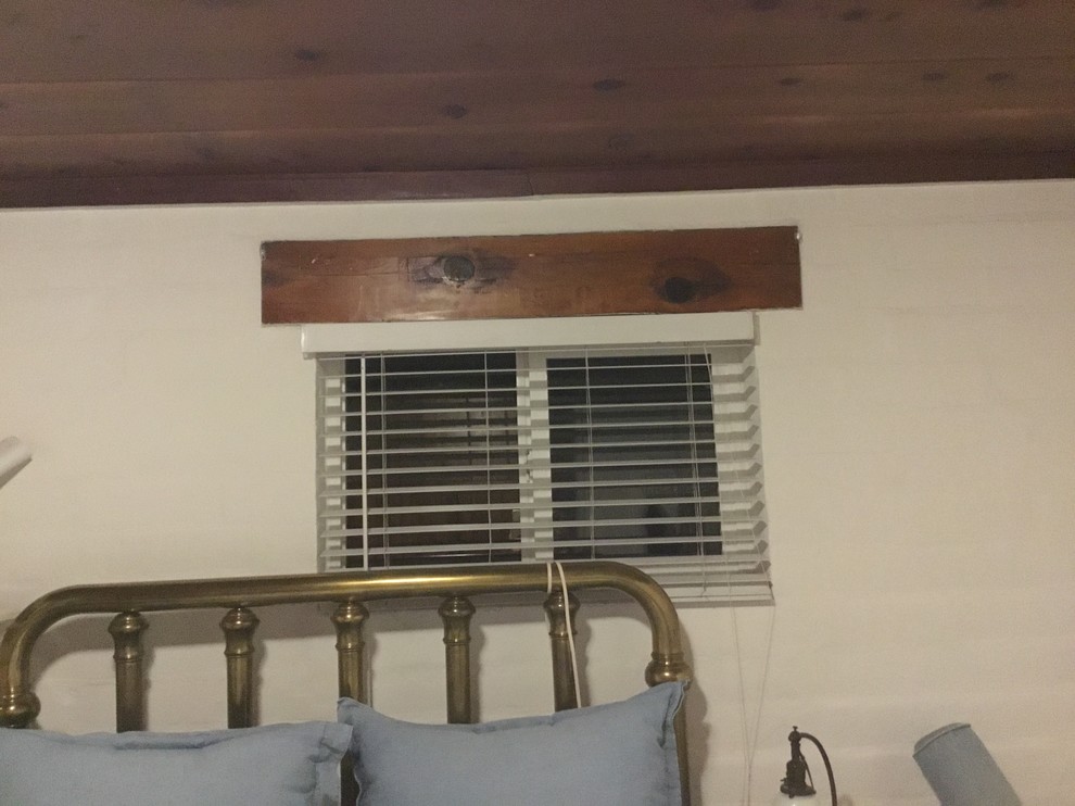 Window covering for windows with rustic wooden lintels