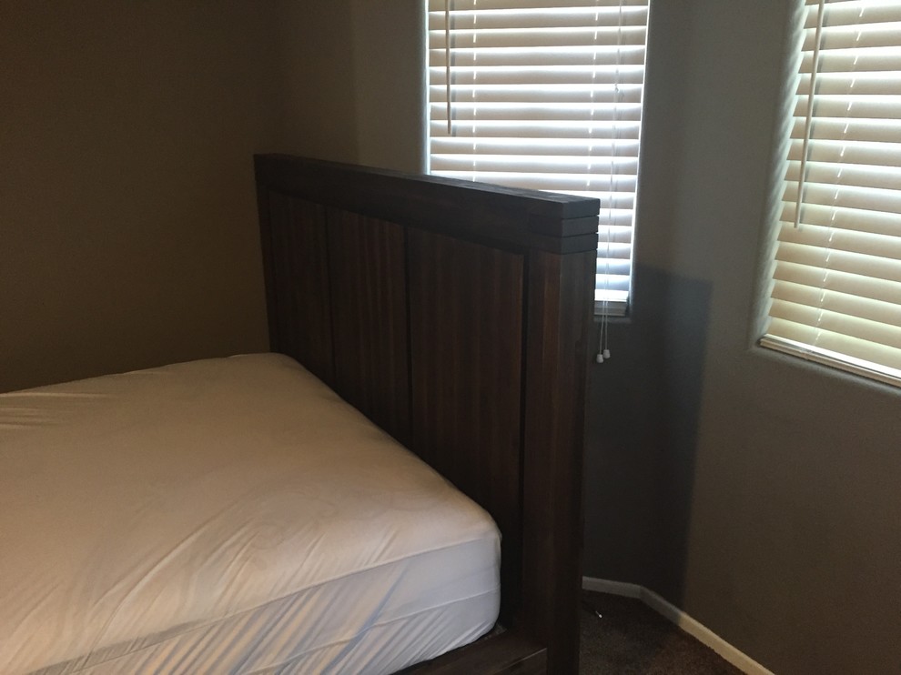 Two full beds in a hexagon (or octagon?) shaped bedroom