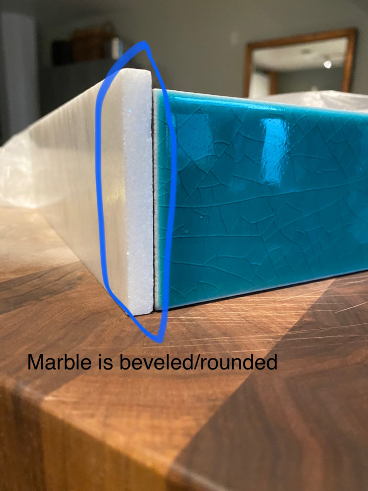 transition between different tile materials at right angle