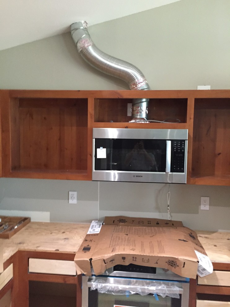 How to hide curved duct below slanted ceiling?