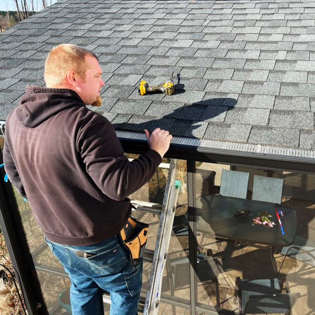 Professional installation of our gutter guard system on your home ...