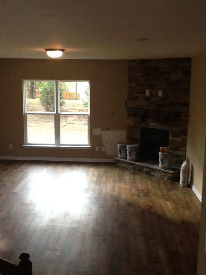 Open floor plan with corner fireplace