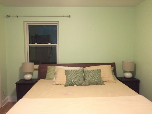 Window off center behind bed