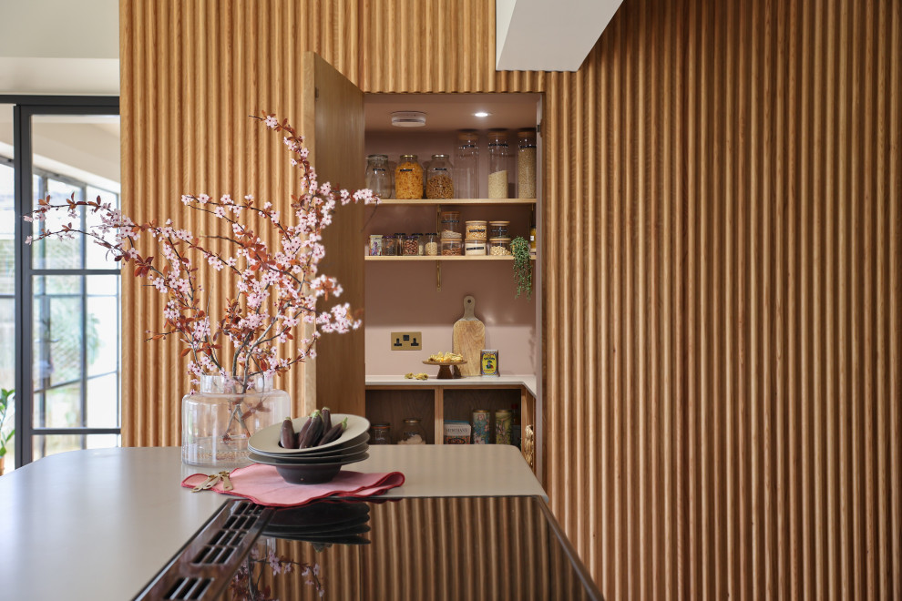 Pantry with door concealed in fluted timber panelling - Contemporary ...