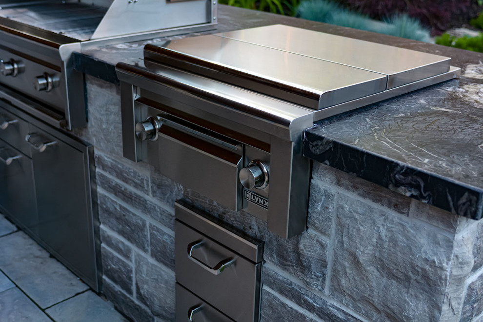 Landscaping design with outdoor patio, outdoor kitchen & driveway ...