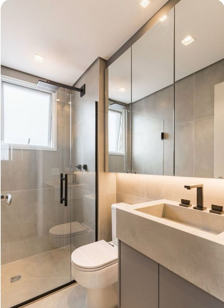 Bathroom mirror extending over toilet