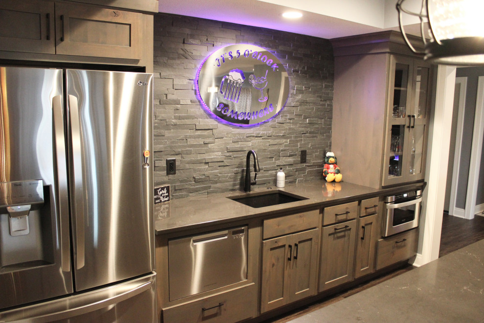 Lower Level Bar With Whiskey Barrel Planks, Gray Cabinets, and Black ...