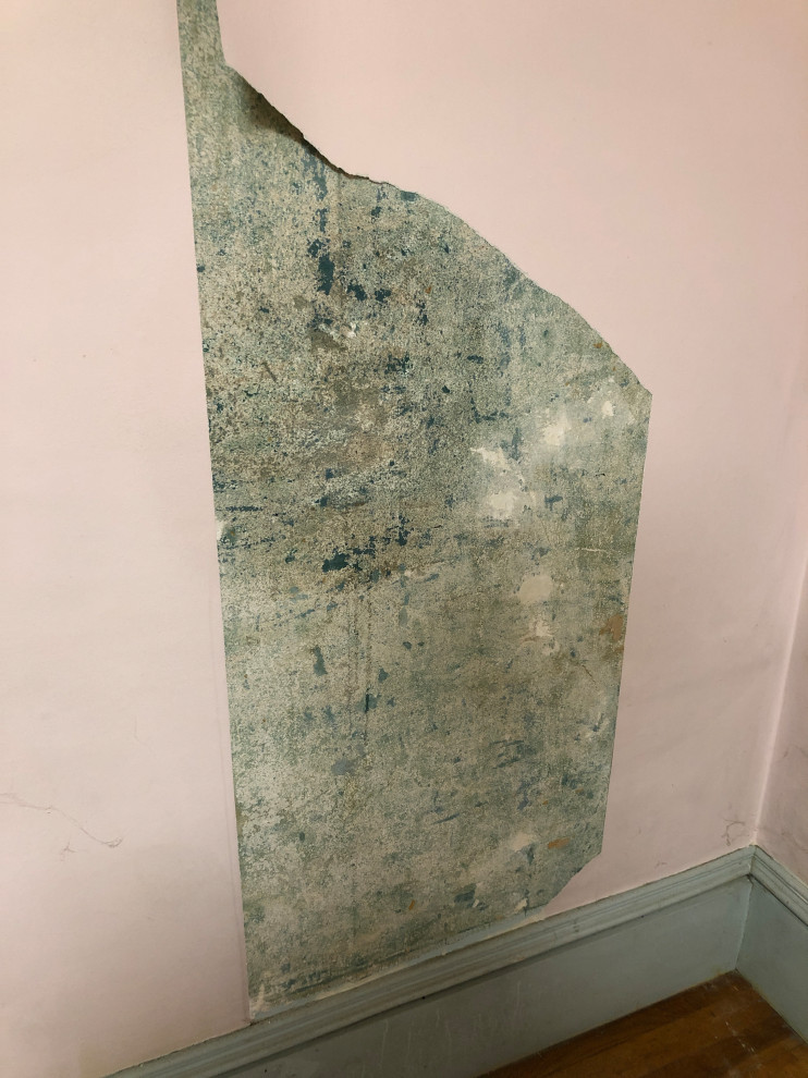 Brown Coat of Plaster under wallpaper?