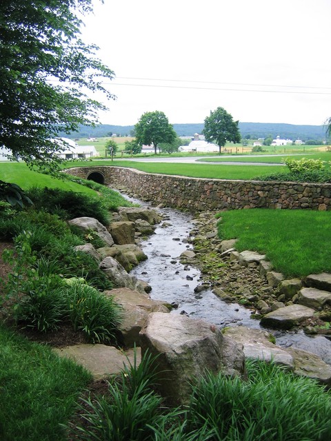 Natural stone walls and stream boulder embankment - Transitional ...