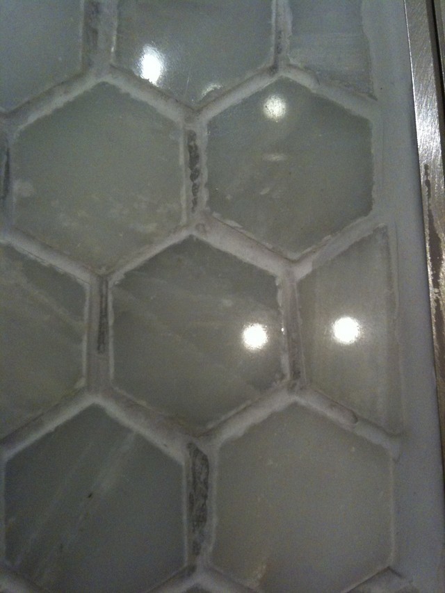 Bill V. & others- Help! Dark spots on new tile and grout?