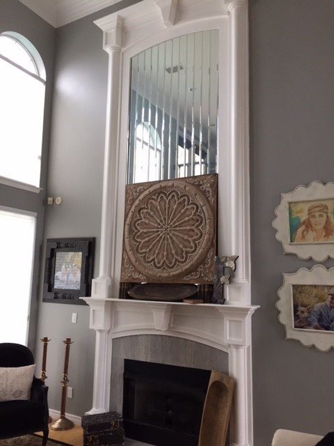 Not a fan of the mirror slats, what can I do over fireplace? 18ft tall