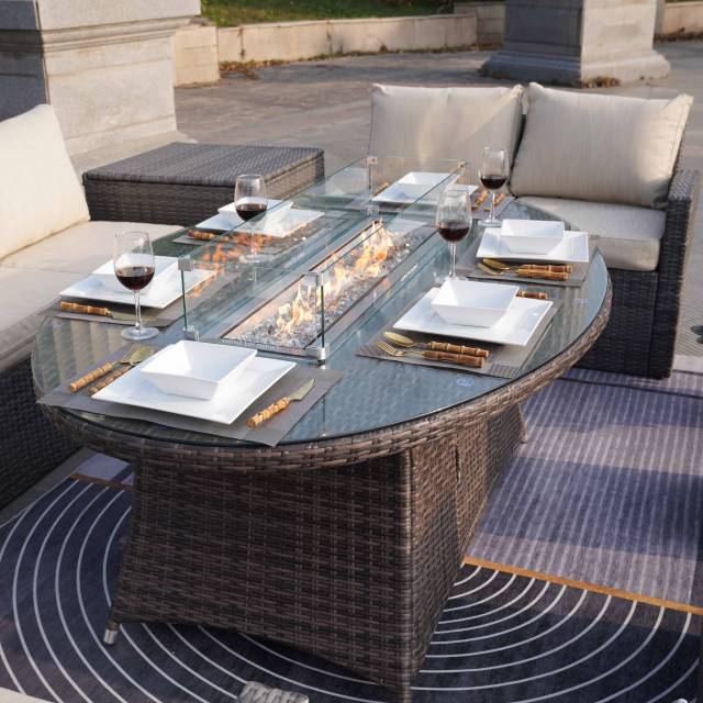 7-piece Patio Wicker Cushioned Sofa with Oval Brown Fire Pits Table ...