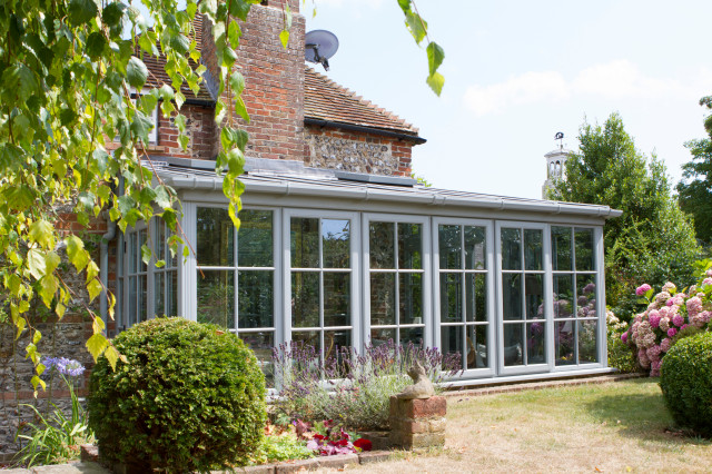 Timber framed lean-to conservatory on a traditional Sussex flint house ...