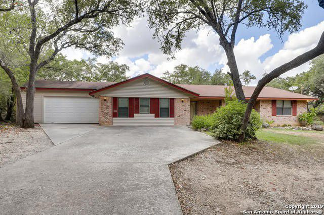Ugly ranch house that needs new roof. Add peaks?