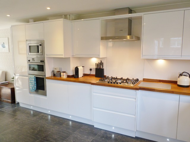 Beautiful white gloss handleless kitchen, with Iroko wood worktops ...