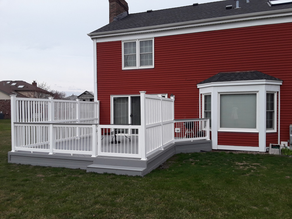 TimberTech Stone Ash Deck with White Vinyl Rails & Privacy Fence in ...