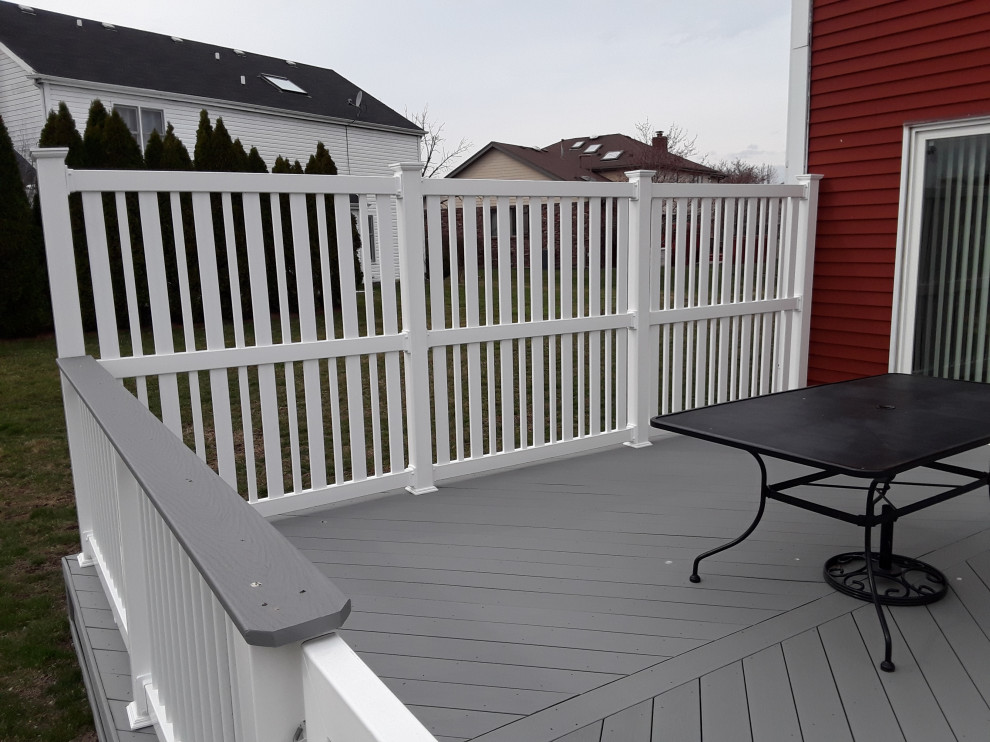 TimberTech Stone Ash Deck with White Vinyl Rails & Privacy Fence in ...