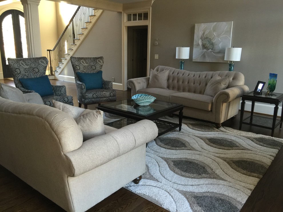 Wall decor for a huge wall with an off center sofa