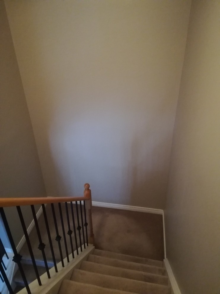 How do I decorate this tall stair wall?