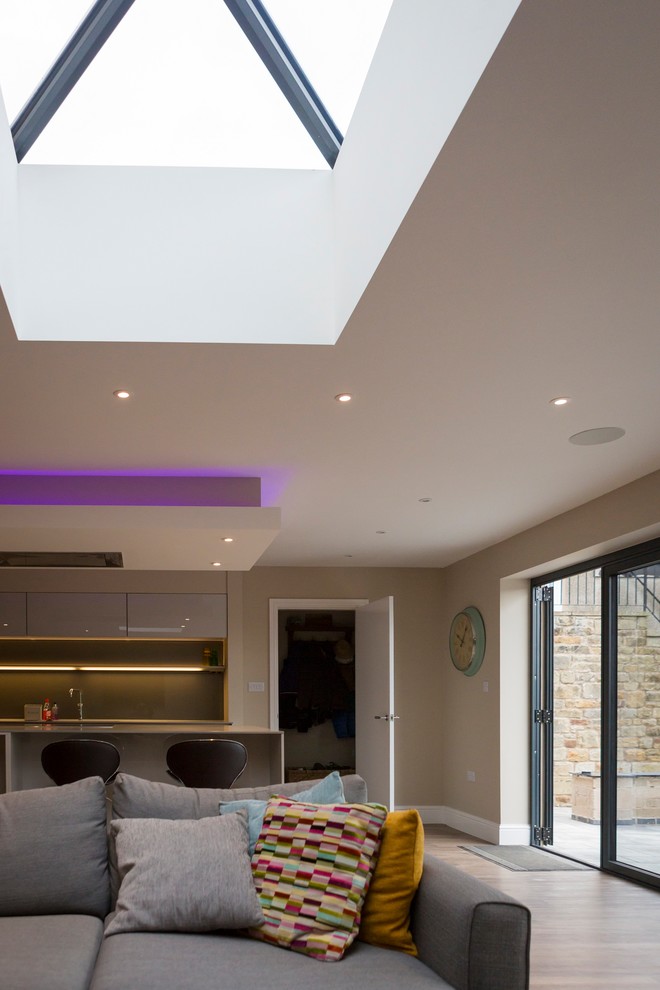 Apex rooflight over lounge area in open plan kitchen diner ...