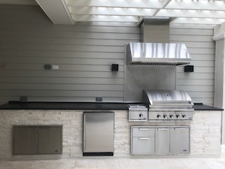 Preventing water intrusion in outdoor summer kitchen
