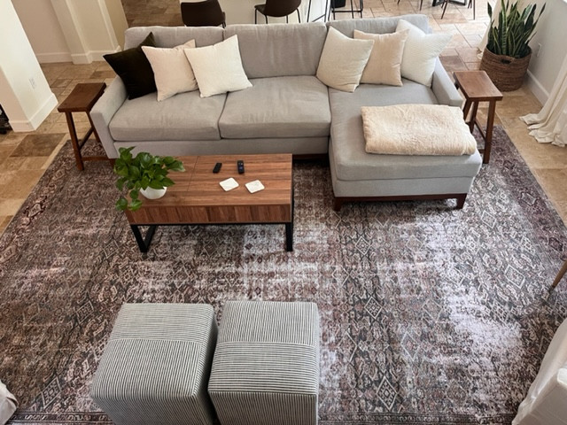 Is my living room rug too big or is my couch too wide?
