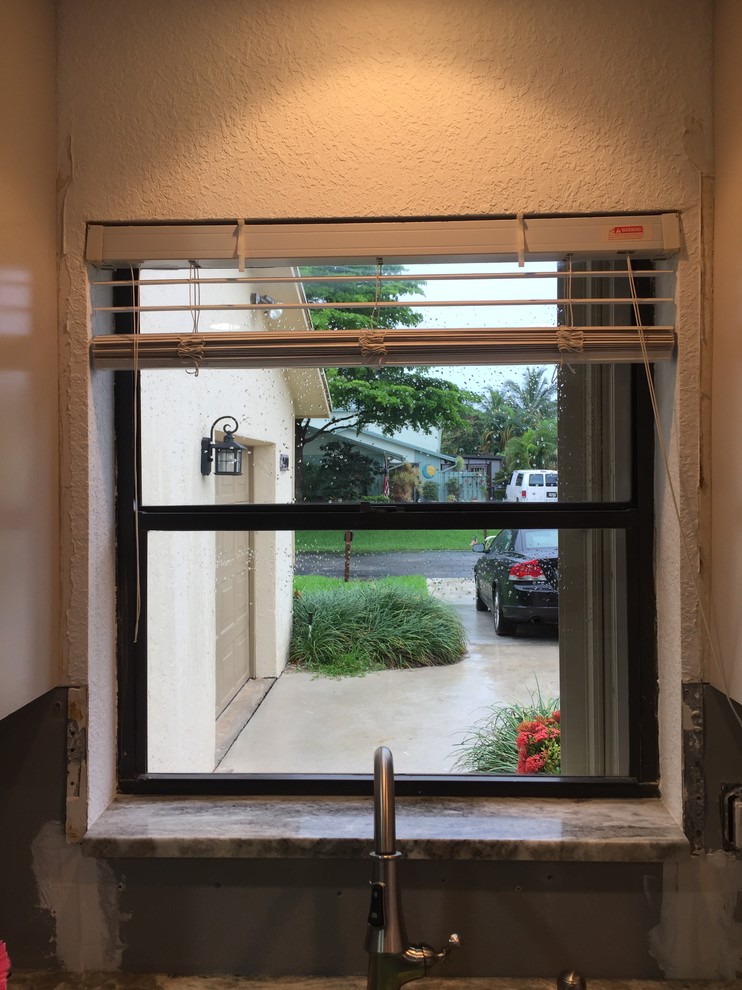 Tiling around a window.