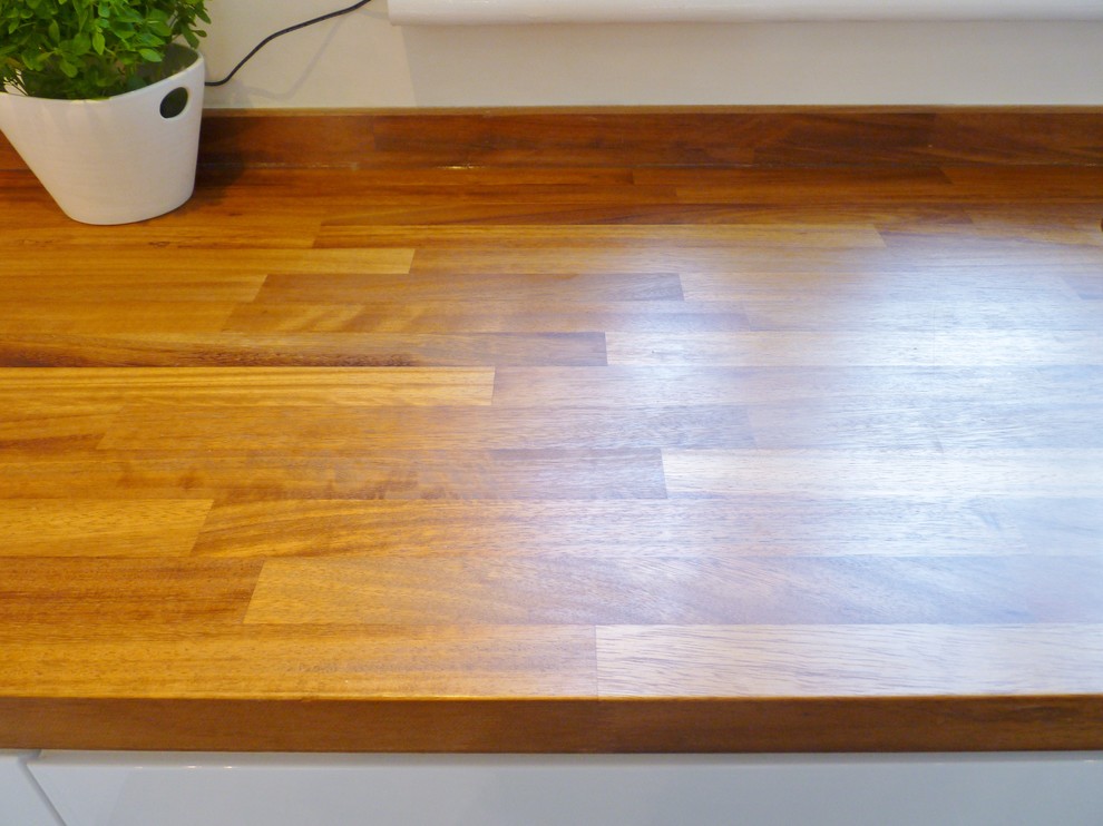 Beautiful white gloss handleless kitchen, with Iroko wood worktops ...