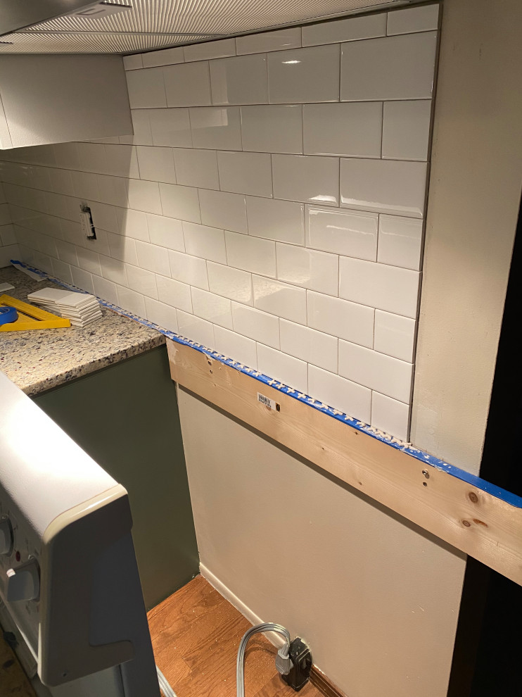 How to tile below countertops, behind range?