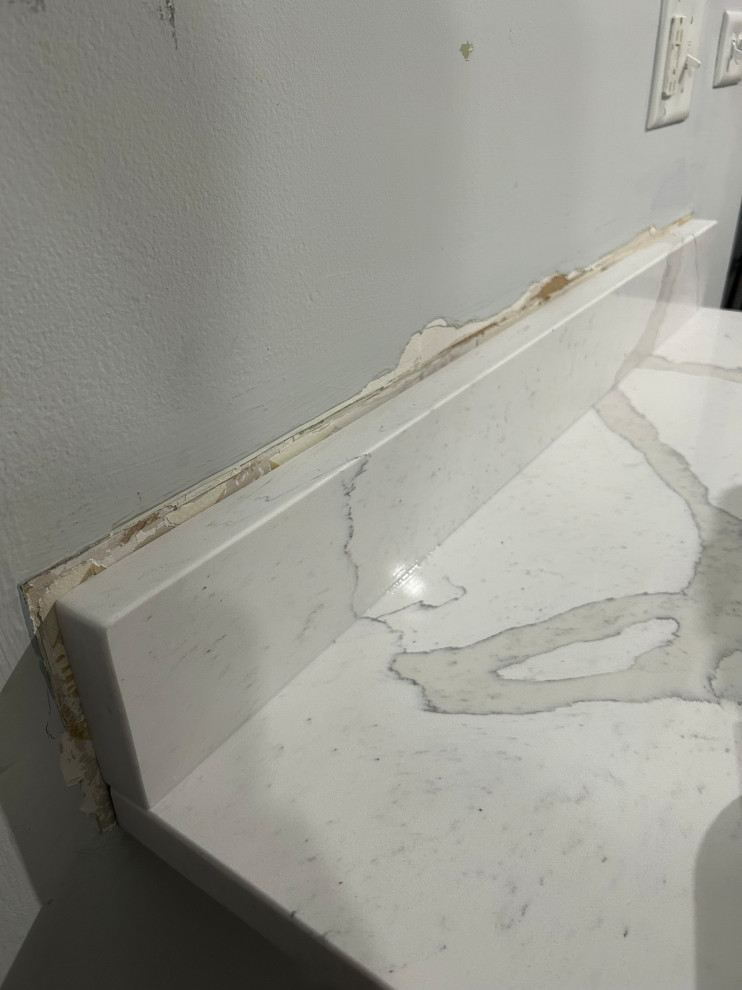 Drywall damaged during kitchen countertop installation. Help!