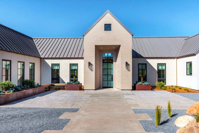 Separation of driveway and entry walk with change of ground plane ...