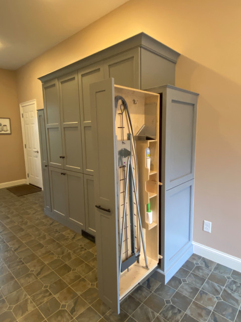 Storage cupboard for hoover and ironing board store