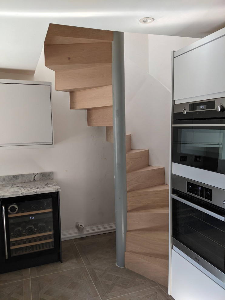 Oak Spiral Staircase with Seamless Waterfall Cladding | Maida Vale W9 ...