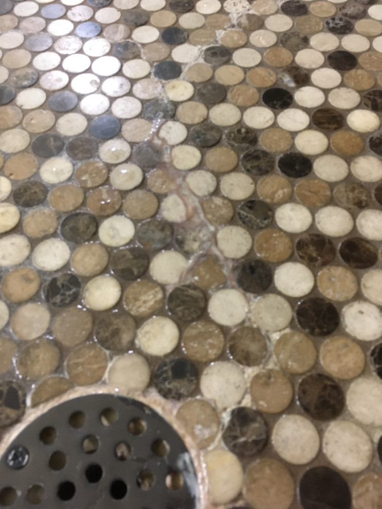 Shower floor tile repair