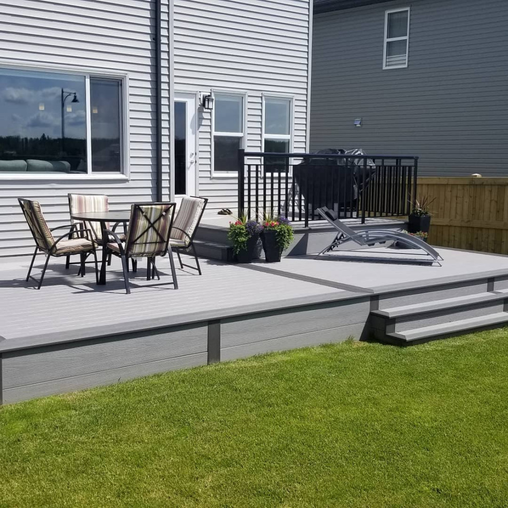 Custom 2 level Fiberon deck with welded railing and wrap around stairs ...