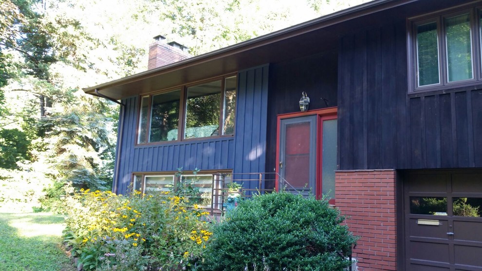 color for the soffits, gutters, and trim on this navy blue house?