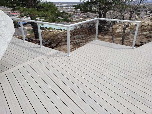 Horizontal cable railing with Deckorators Voyage Tundra decking ...