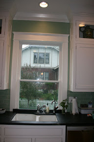 Sink in front of low window / banquette / old house
