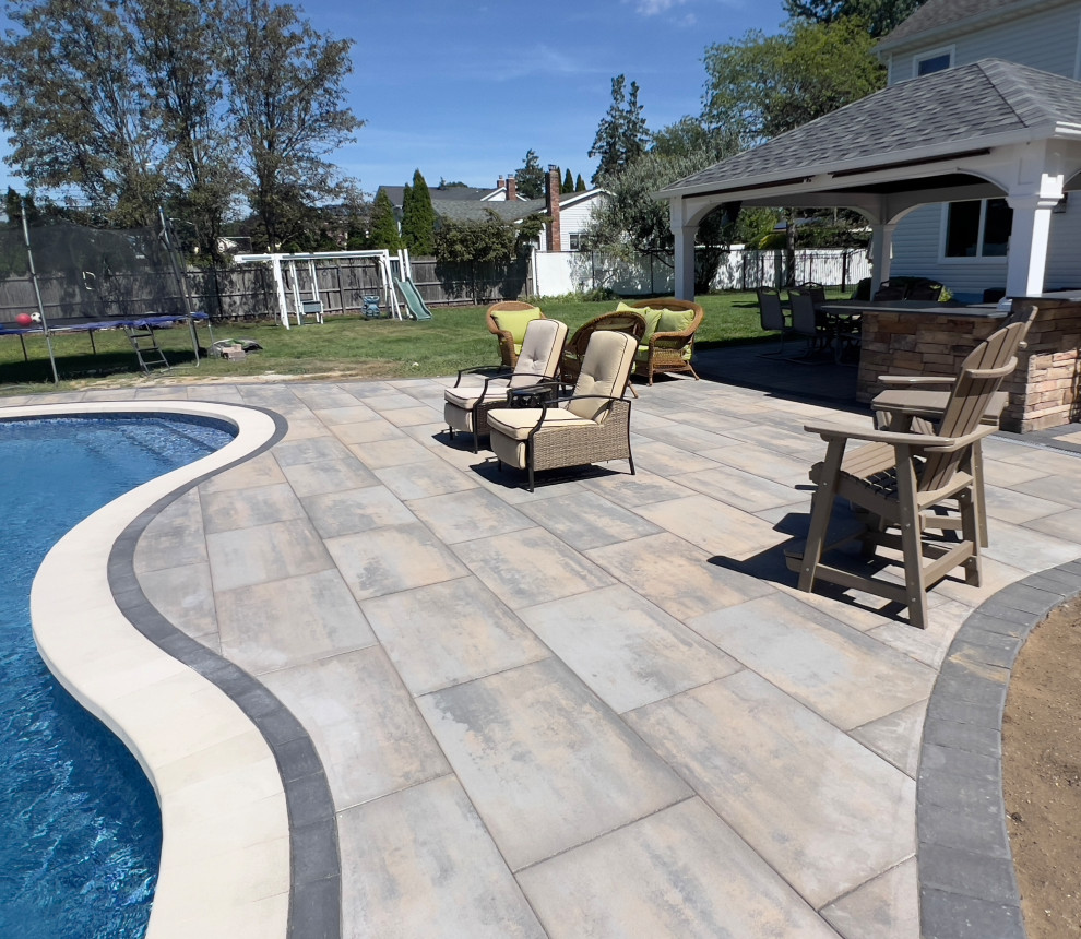 Unilock XL smooth Almond Grove Pool Patio with Travertine Waterfalls - Deer Park - Contemporary ...