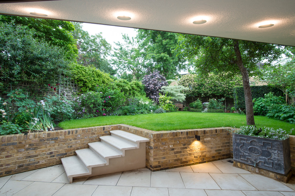 London extension patio with retaining wall and steps - Contemporary ...