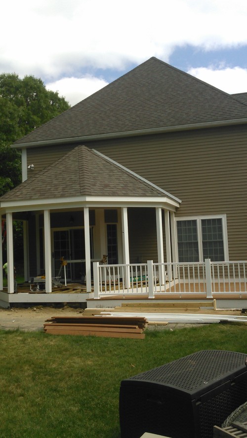 Octagon shape, turret style roof, screened porch.
